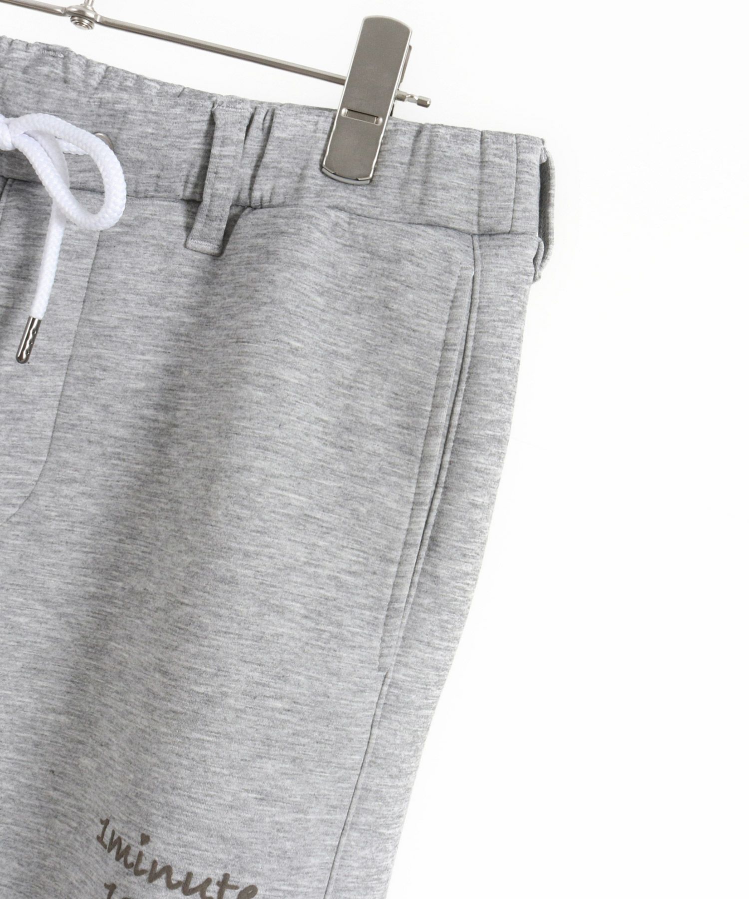 【1minute 1second(ワンミニットワンセカンド)】cursive print cardboard knit pants スリム ...